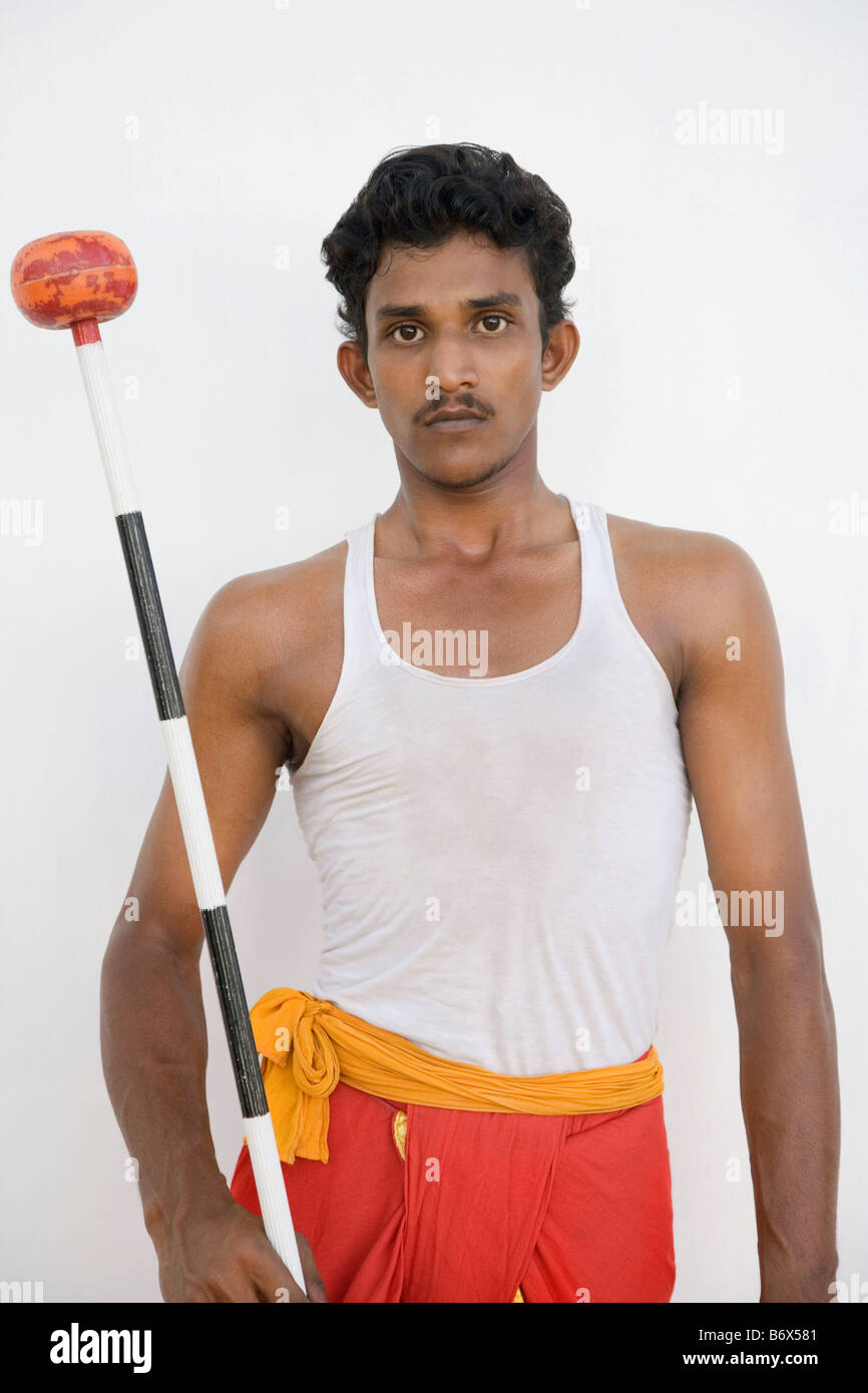 Young man standing holding stick staff hi-res stock photography and ...