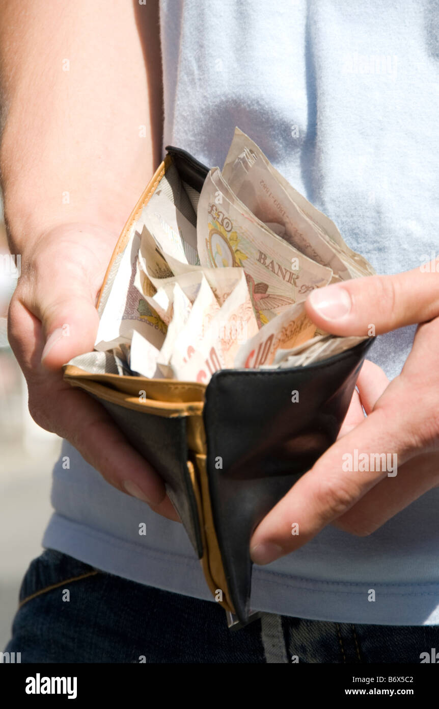 Wallet full of cash hi-res stock photography and images - Alamy