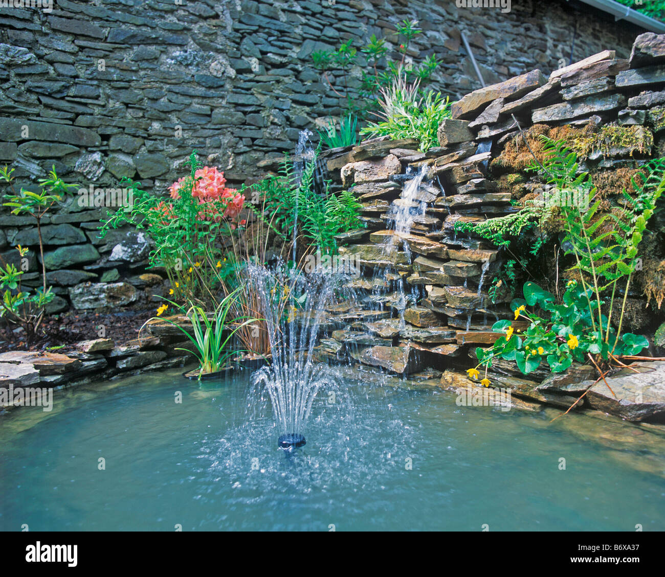 WATERFALL AND SPRAY FOUNTAIN IN SPRING Stock Photo - Alamy
