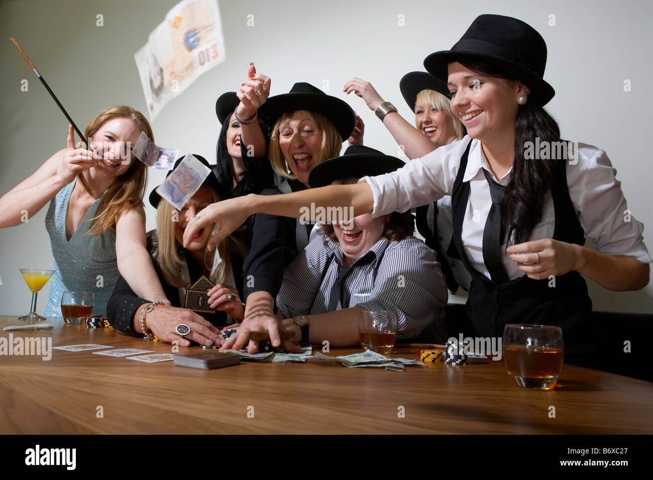 Woman playing poker Stock Photo - Alamy