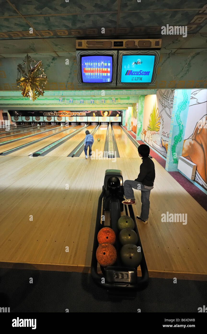 France Coignieres town, young boys playing bowling Stock Photo - Alamy