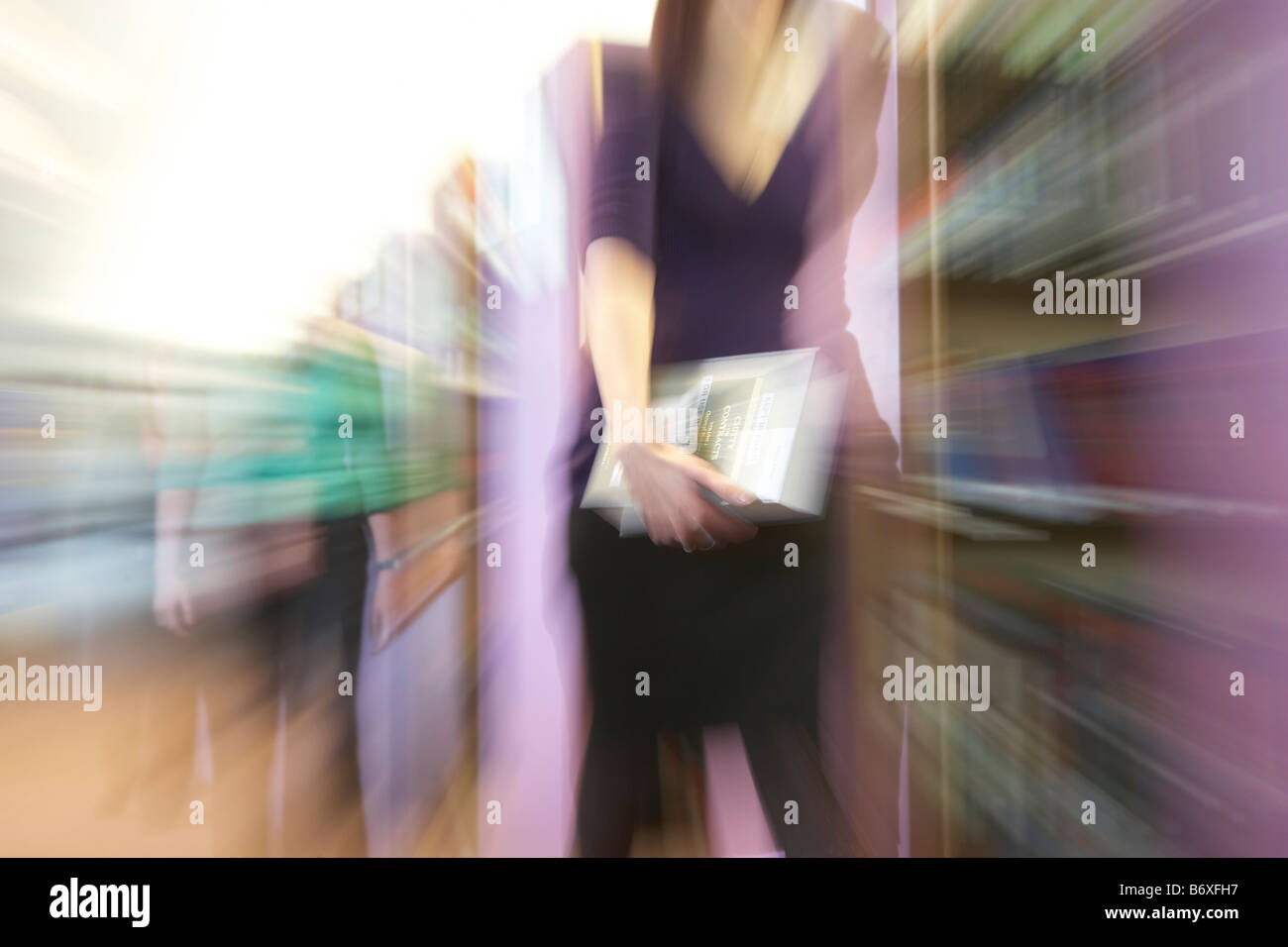 Female with book moving Stock Photo - Alamy