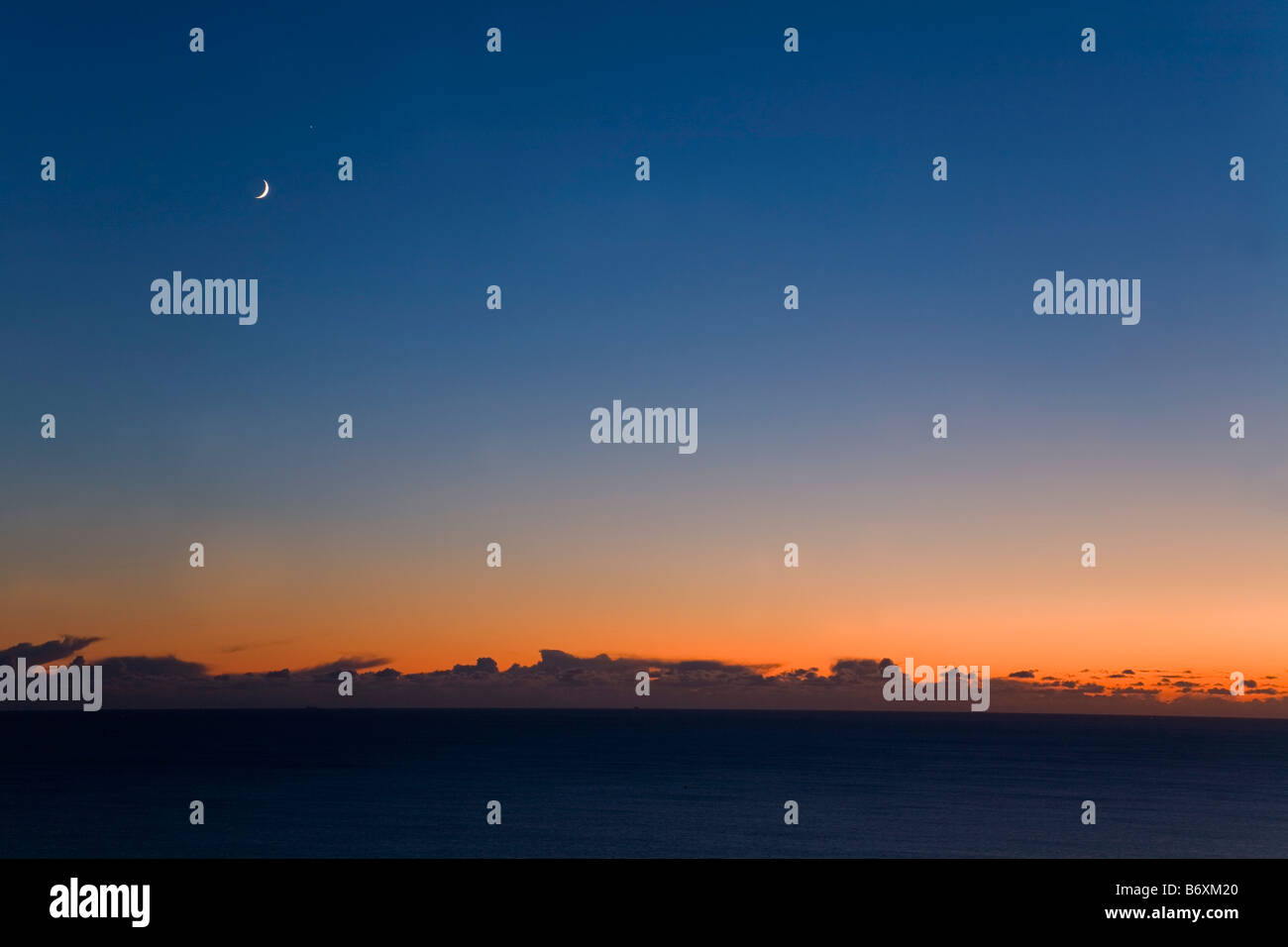 the moon and jupiter from the cornwall coast Stock Photo - Alamy