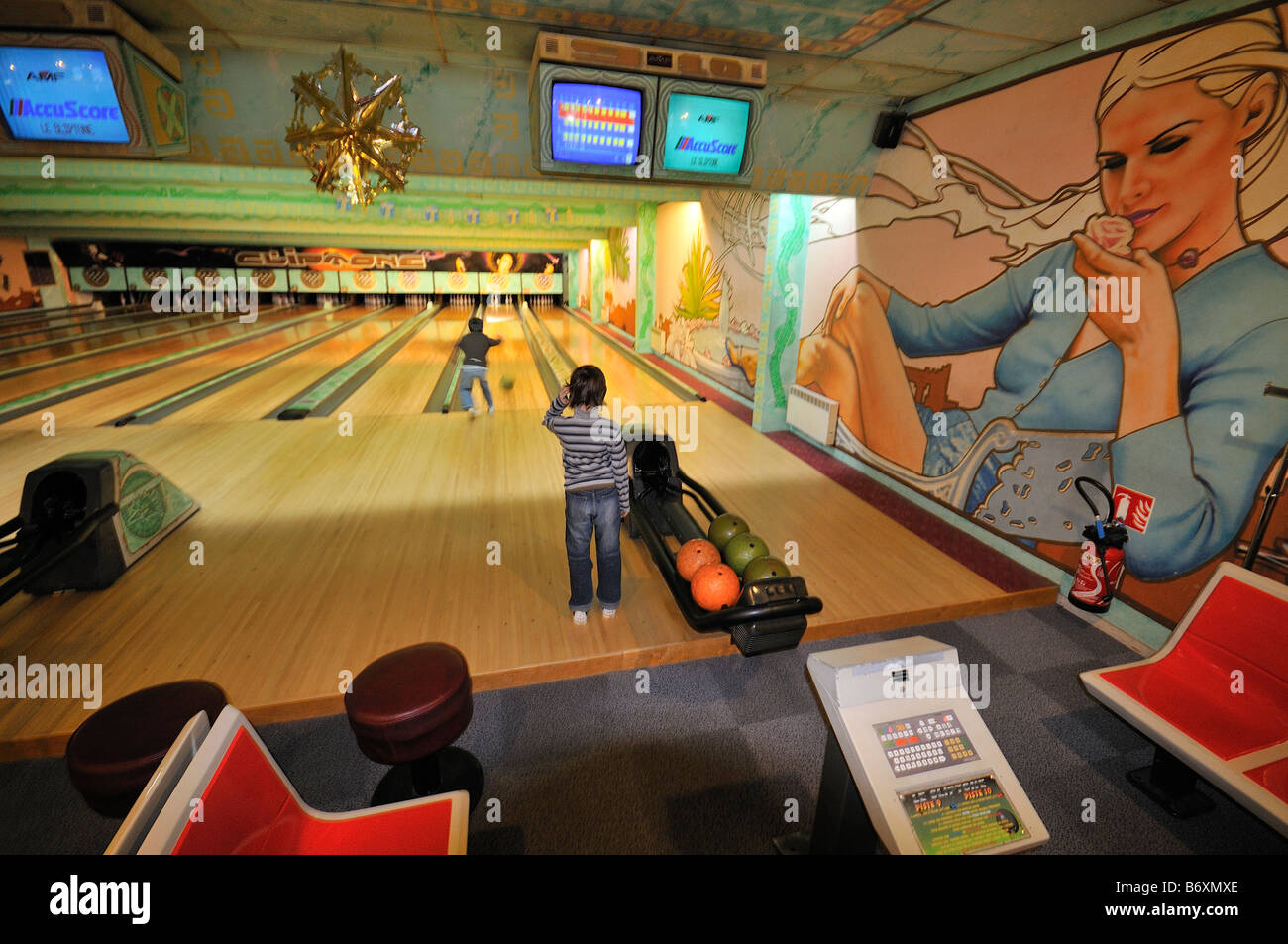 France Coignieres town, young boys playing bowling Stock Photo - Alamy