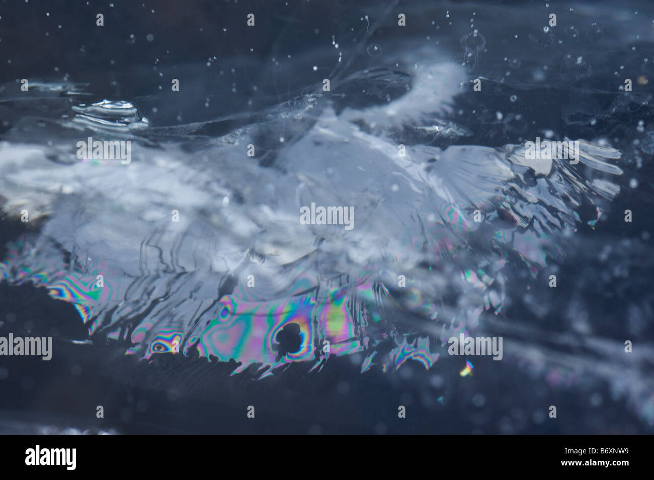 light as a colour spectrum in lake ice, Sweden Stock Photo - Alamy