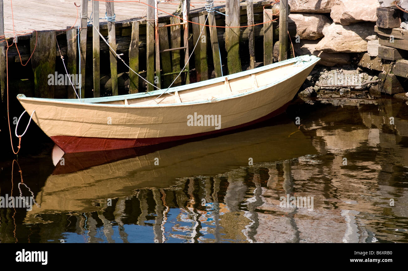 Yellow and Red Dory floating in harbour at Eastern Pasage Nova Scotia ...