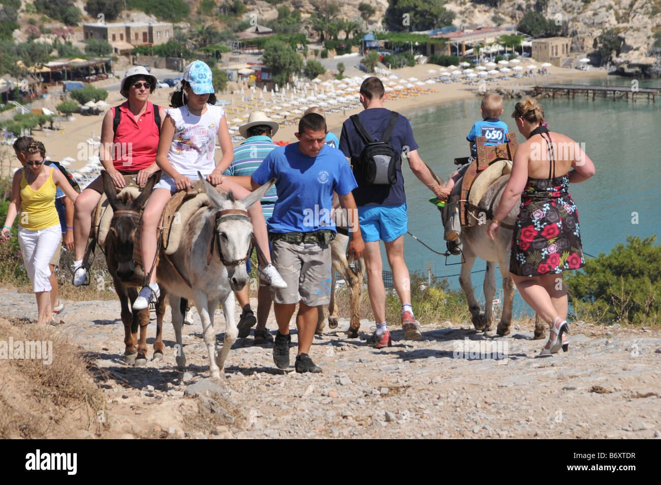 Tourist riding donkeys, Lindos, Rhodes, Greece Stock Photo - Alamy