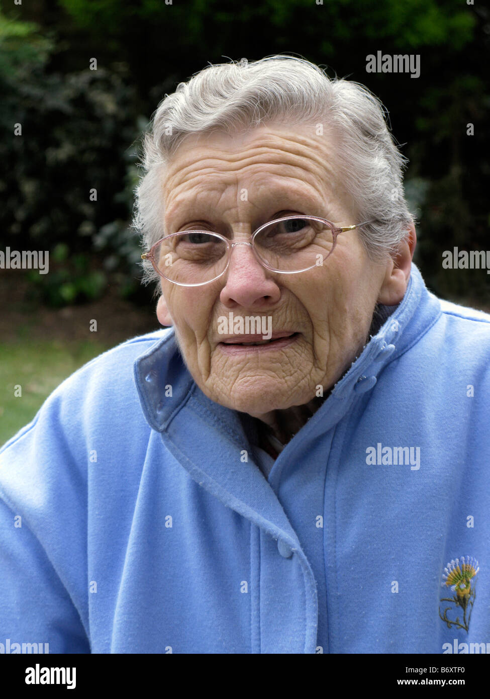 elderly woman feeling very cold due to freezing temperatures Stock ...