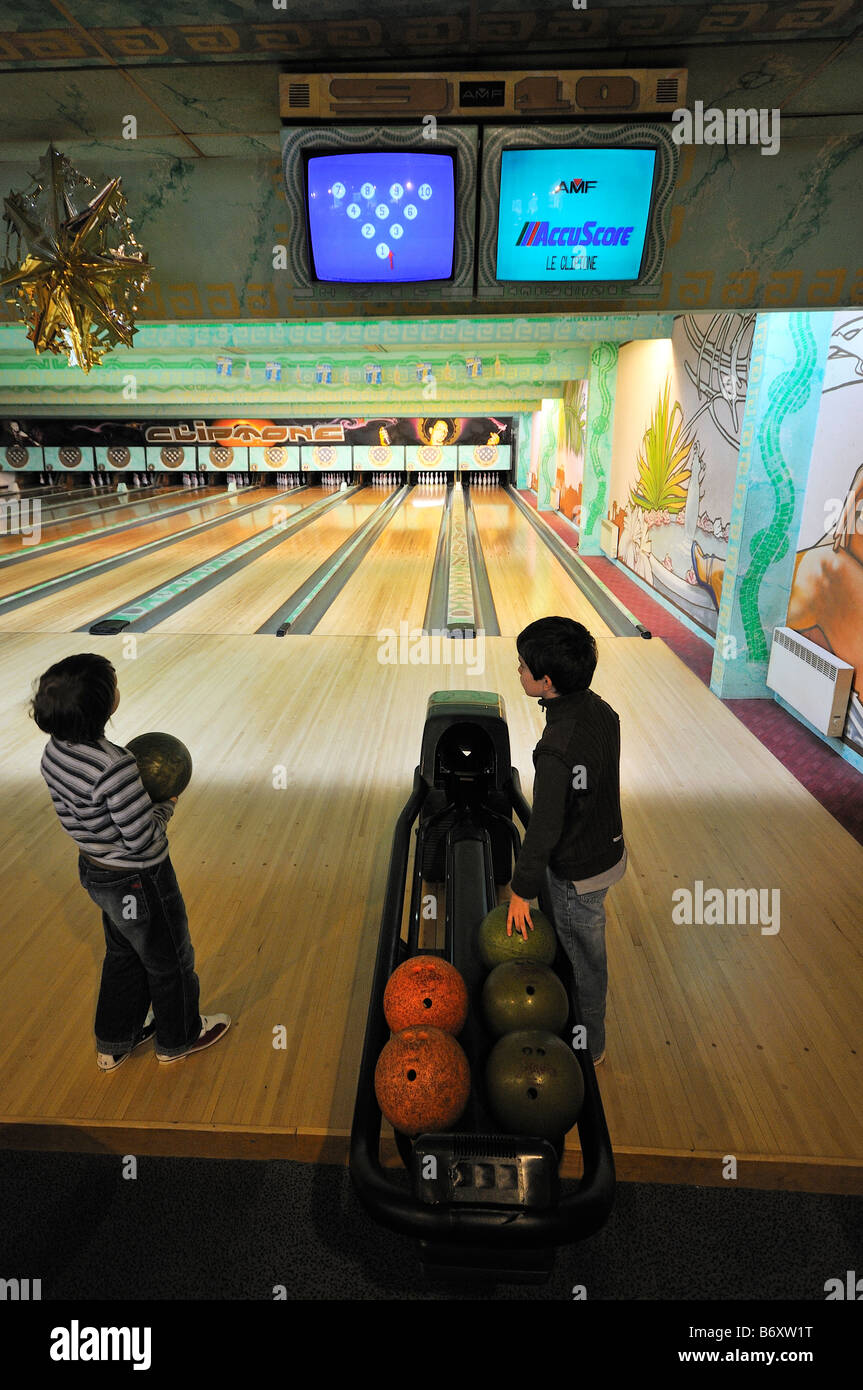France Coignieres town, young boys playing bowling Stock Photo - Alamy