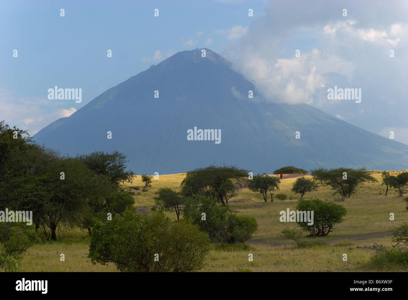 The steep cone of Ol Doinyo Lengai volcano in the savannah near Lake ...