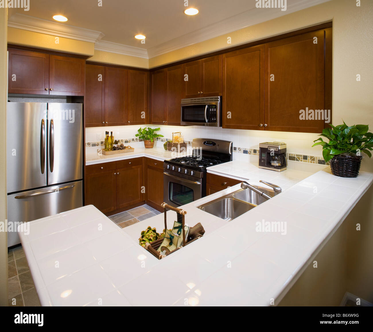 Traditional kitchen with wooden cabinets and crown molding Stock Photo ...