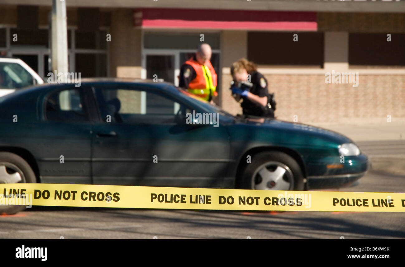 Crime scene photographer documenting an accident Stock Photo - Alamy