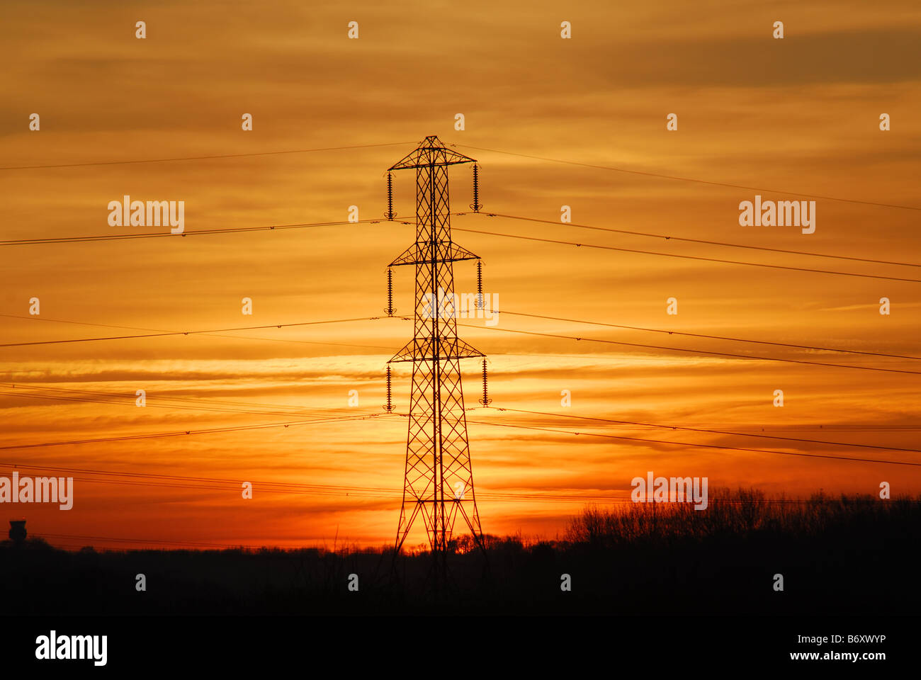 Electric Pylon Setting Sun Stock Photo - Alamy
