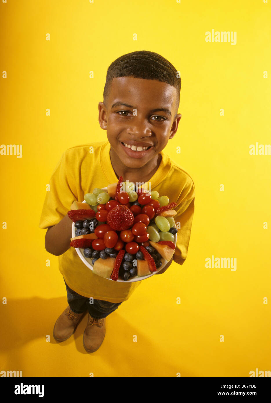 Child plate full of fruits Stock Photo - Alamy