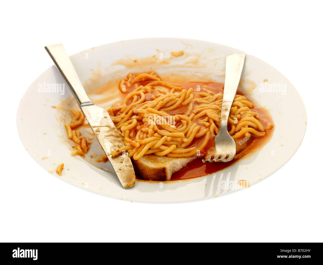 Tinned Spaghetti In Tomato Sauce On Toast Leftovers On A Plate with A ...