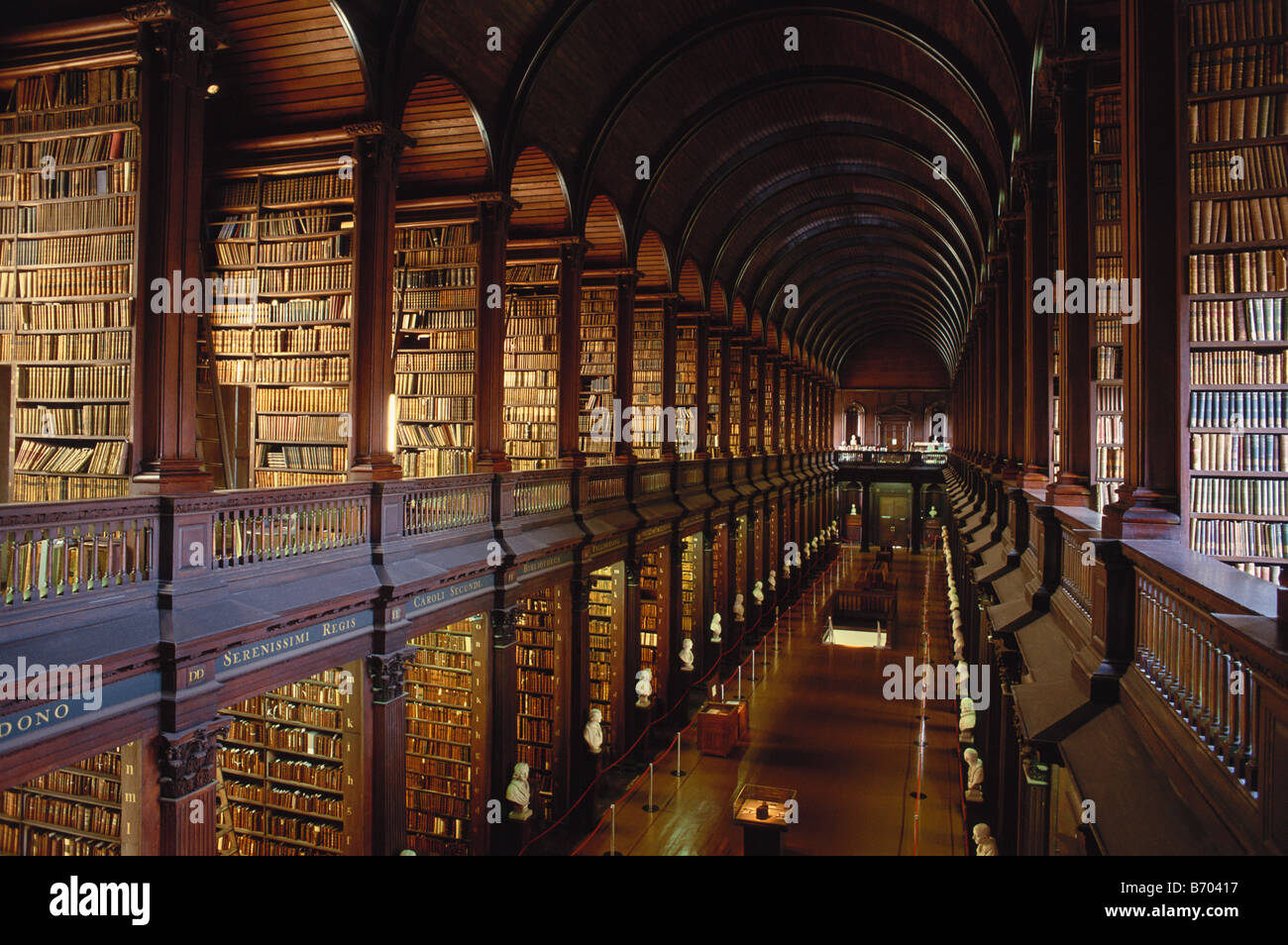 Rows of books inside Trinity College, Long Hall Library, Dublin ...