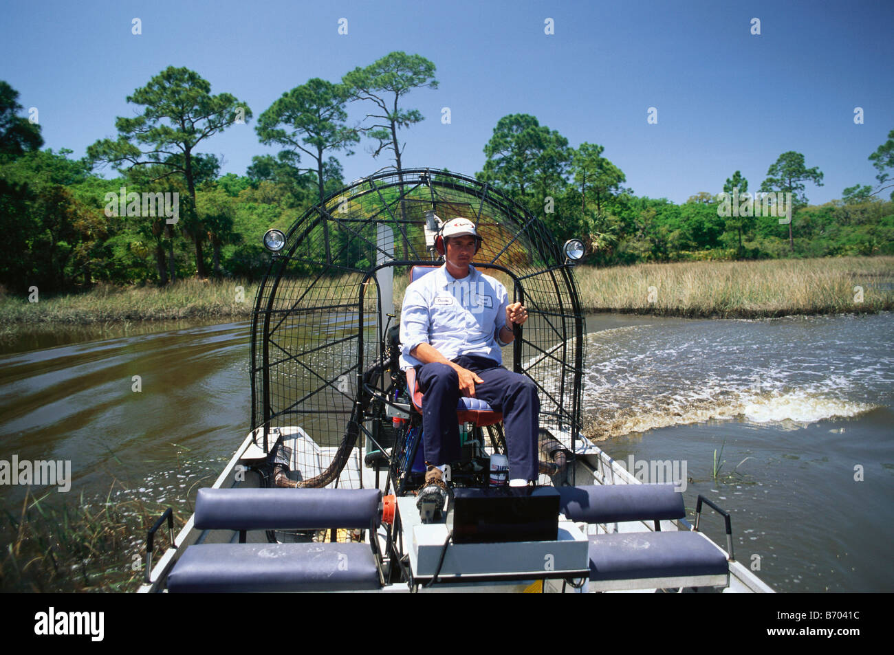 Man driving an airboat for an airboat tour, Everglades, Florida, USA ...