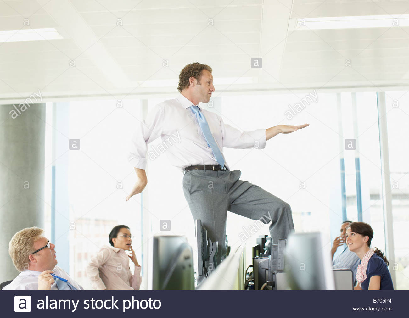 Businessman dancing on cubicle desk Stock Photo: 21517500 - Alamy