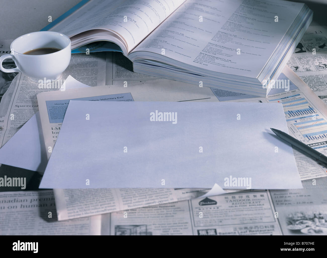 White papers on the newspaper Stock Photo - Alamy