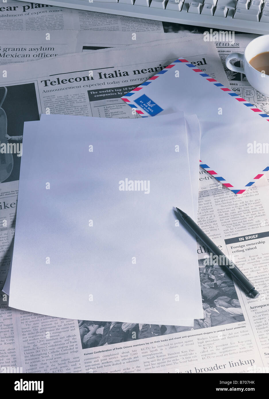 White papers on the newspaper Stock Photo - Alamy