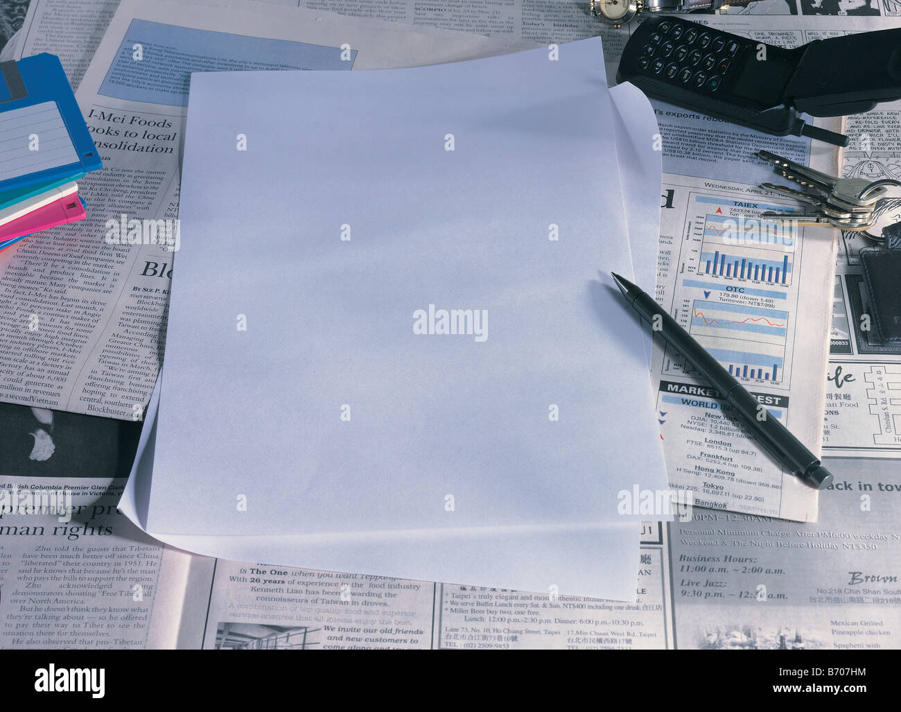 White papers on the newspaper Stock Photo - Alamy