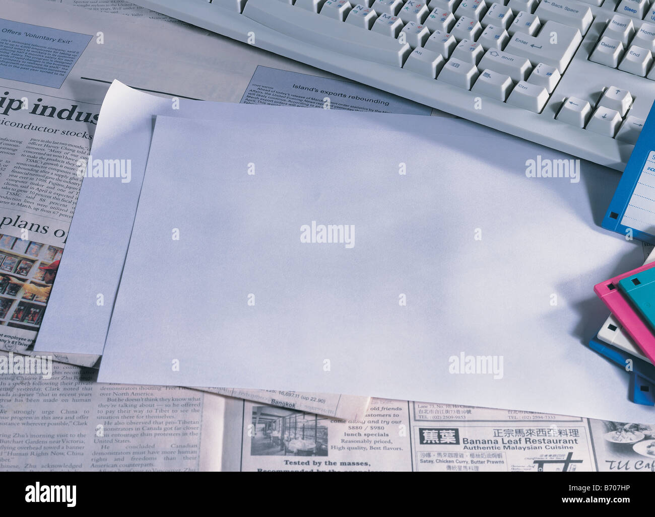 White papers on the newspaper Stock Photo - Alamy