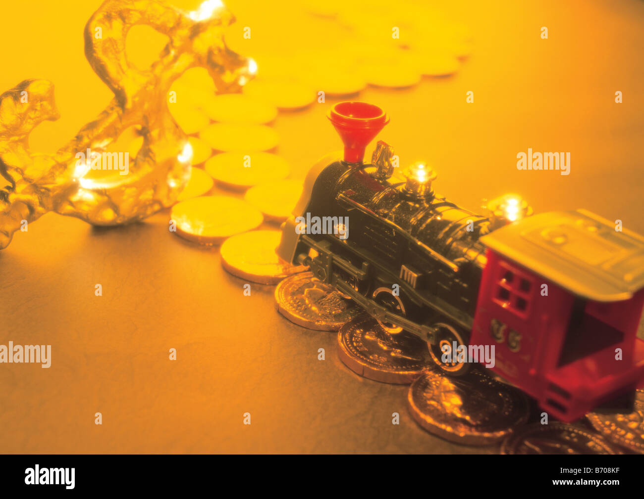 Train running on the gold coins Stock Photo - Alamy