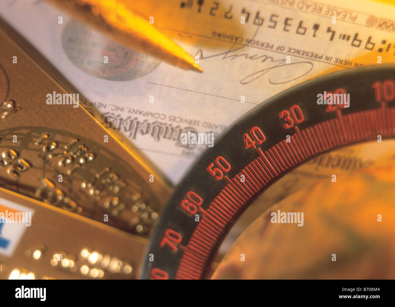 Check, credit cards and ruler Stock Photo - Alamy