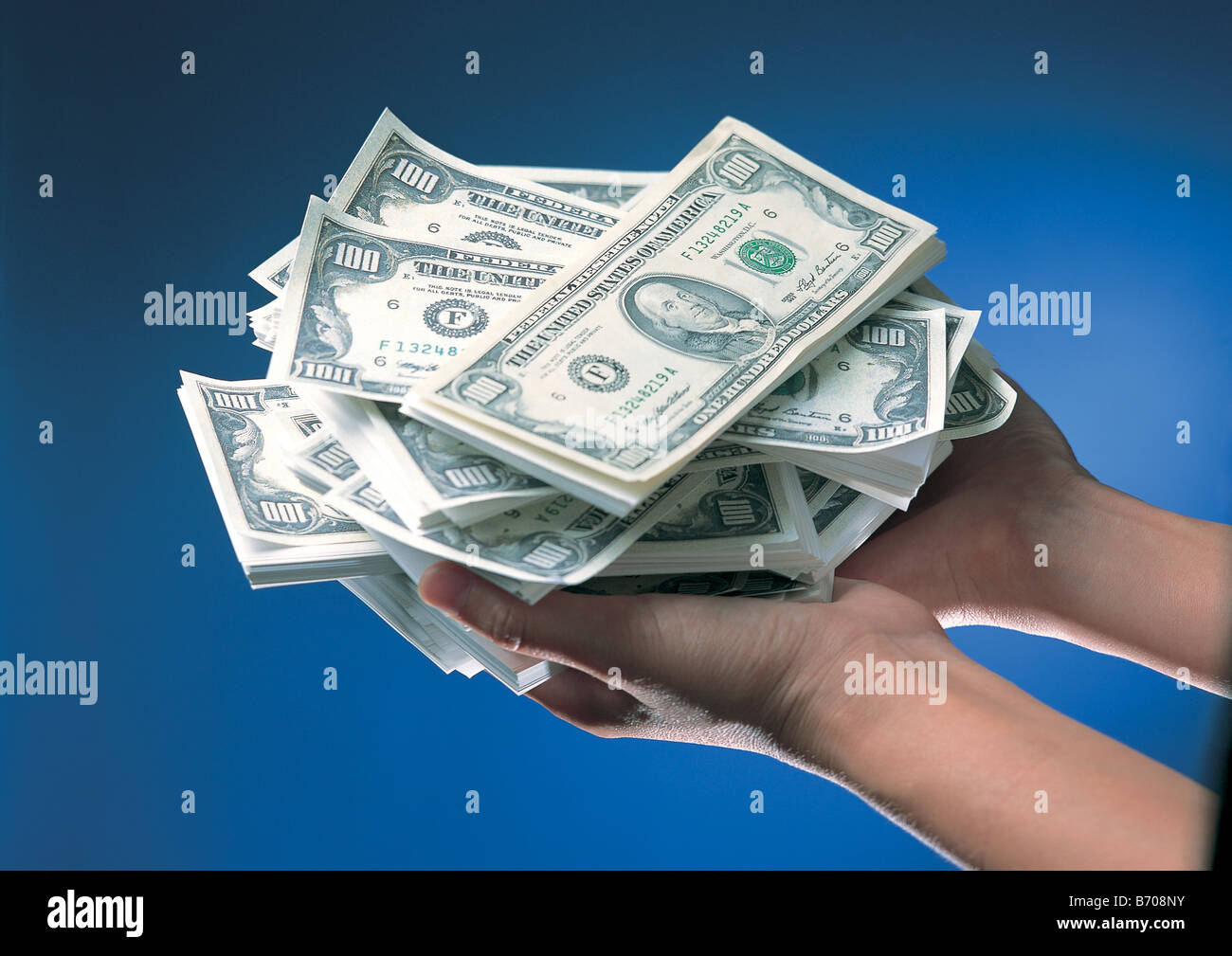 Money carried by both hands Stock Photo - Alamy