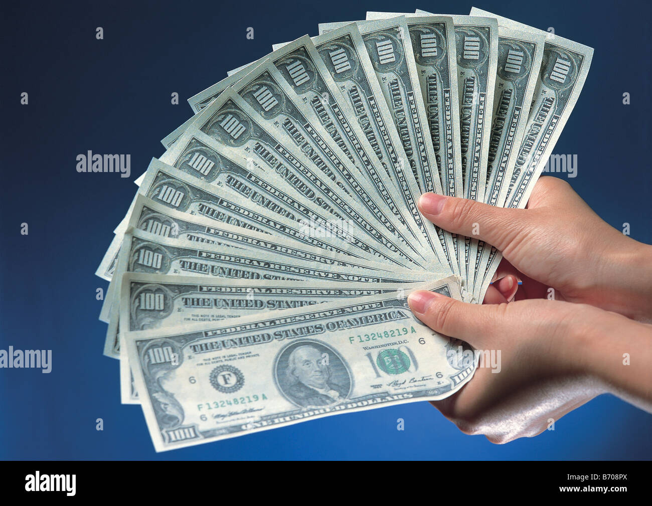 Both hands are holding money Stock Photo - Alamy