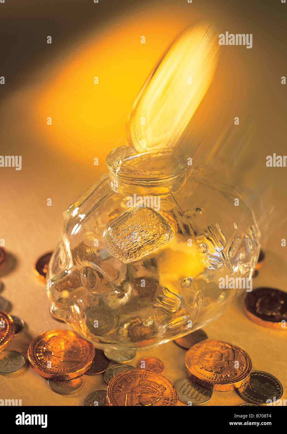 Through coins into glass bottle Stock Photo - Alamy