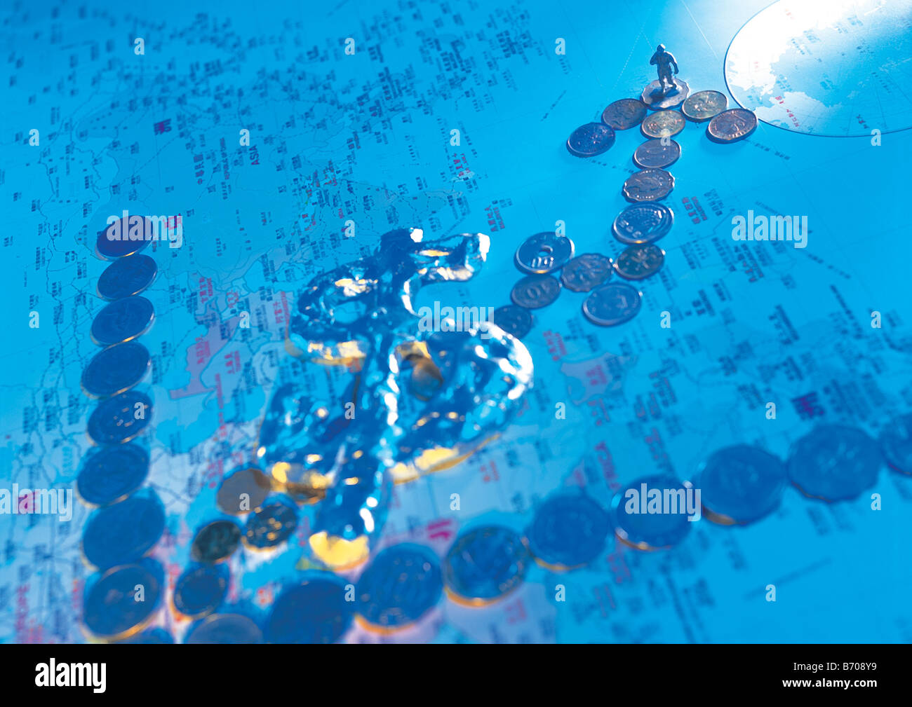 Dollar sign and coins are on the map Stock Photo - Alamy