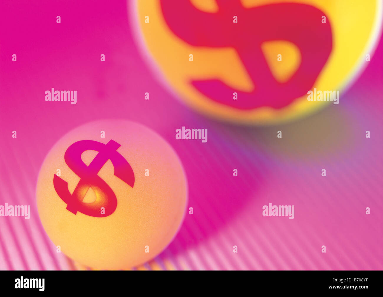 Two balls with dollar signs Stock Photo - Alamy