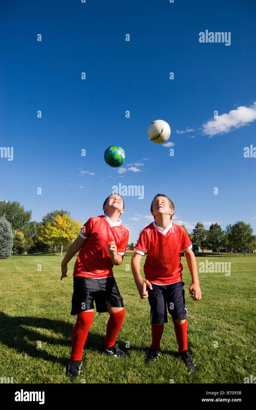 Two boys do a header with the soccer ball in Fort Collins, Colorado ...