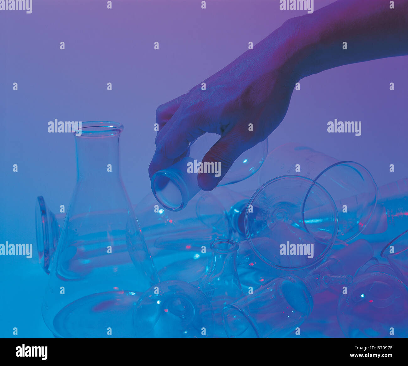 Holding glass test bottle by hand Stock Photo - Alamy