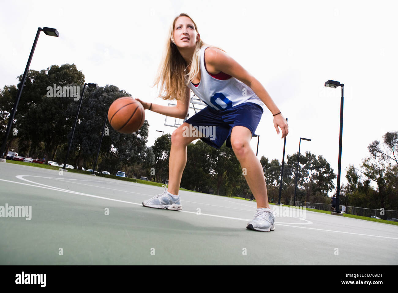 Portrait athletic woman playing basketball hi-res stock photography and ...