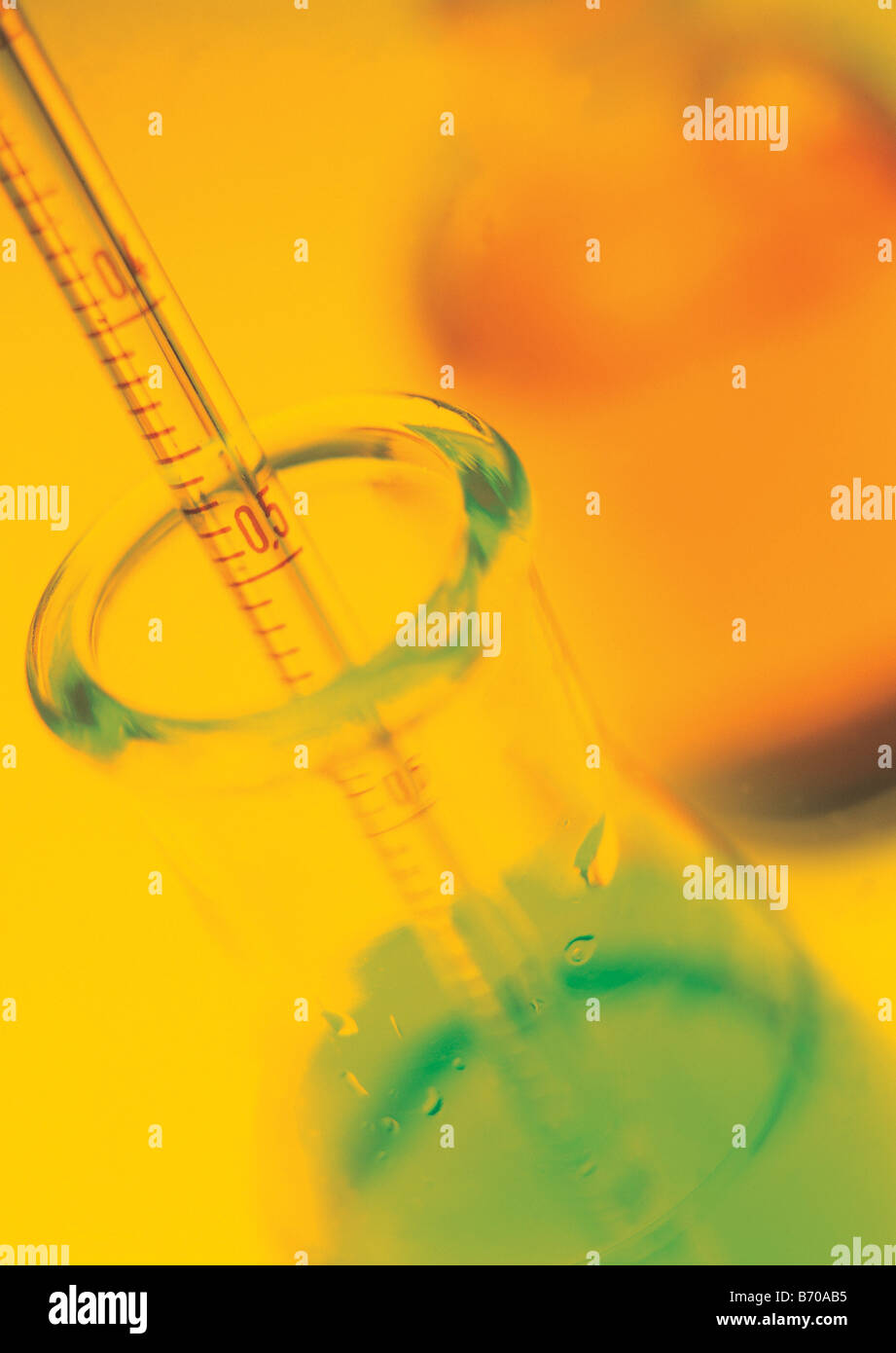 Close-up of beaker and dropper Stock Photo - Alamy