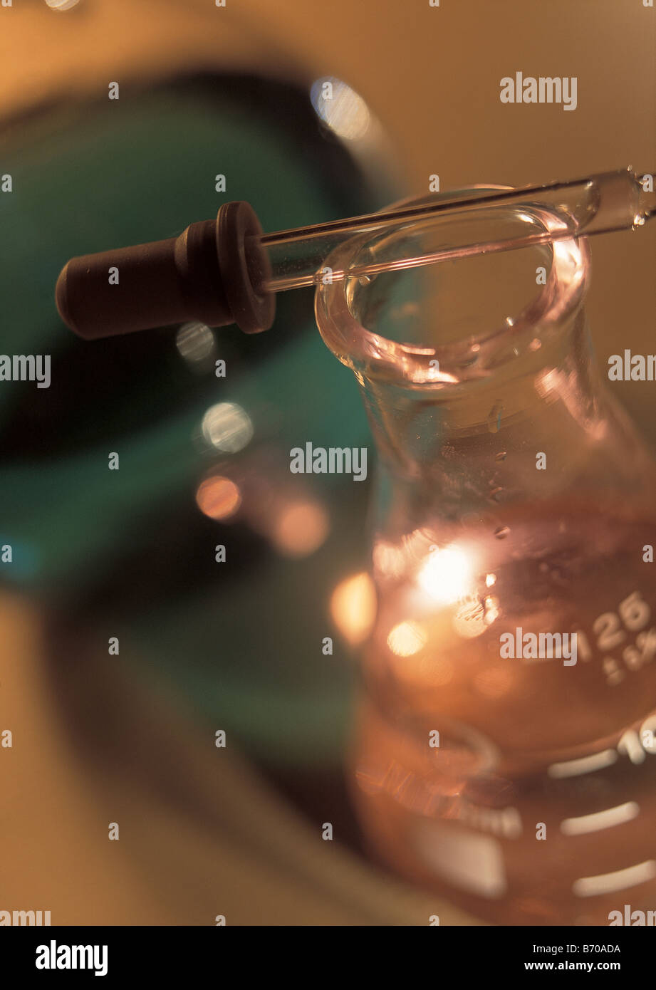 Close-up of beaker and dropper Stock Photo - Alamy
