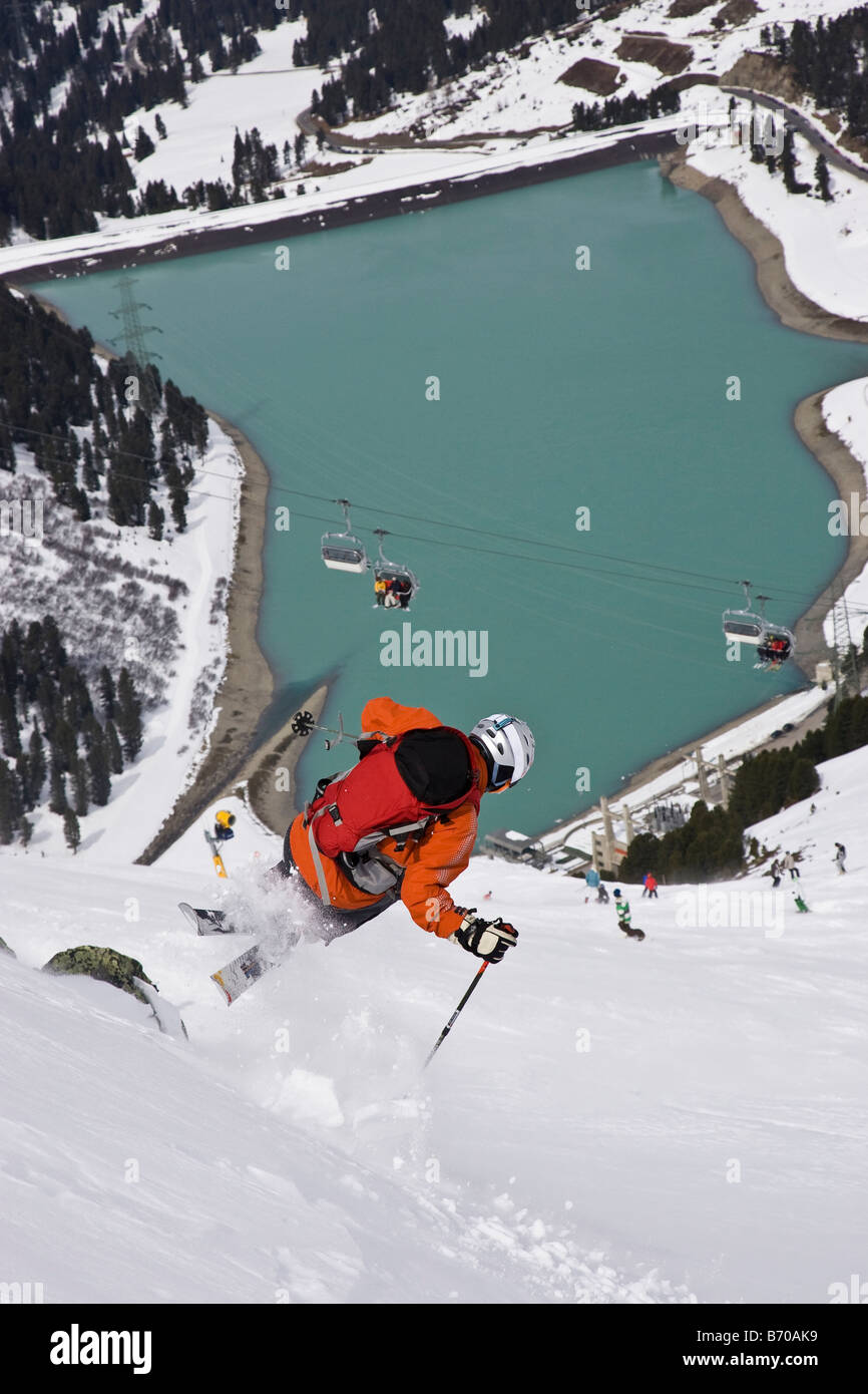A young man skis fresh powder off-piste at the Kuhtai Ski Resort near ...