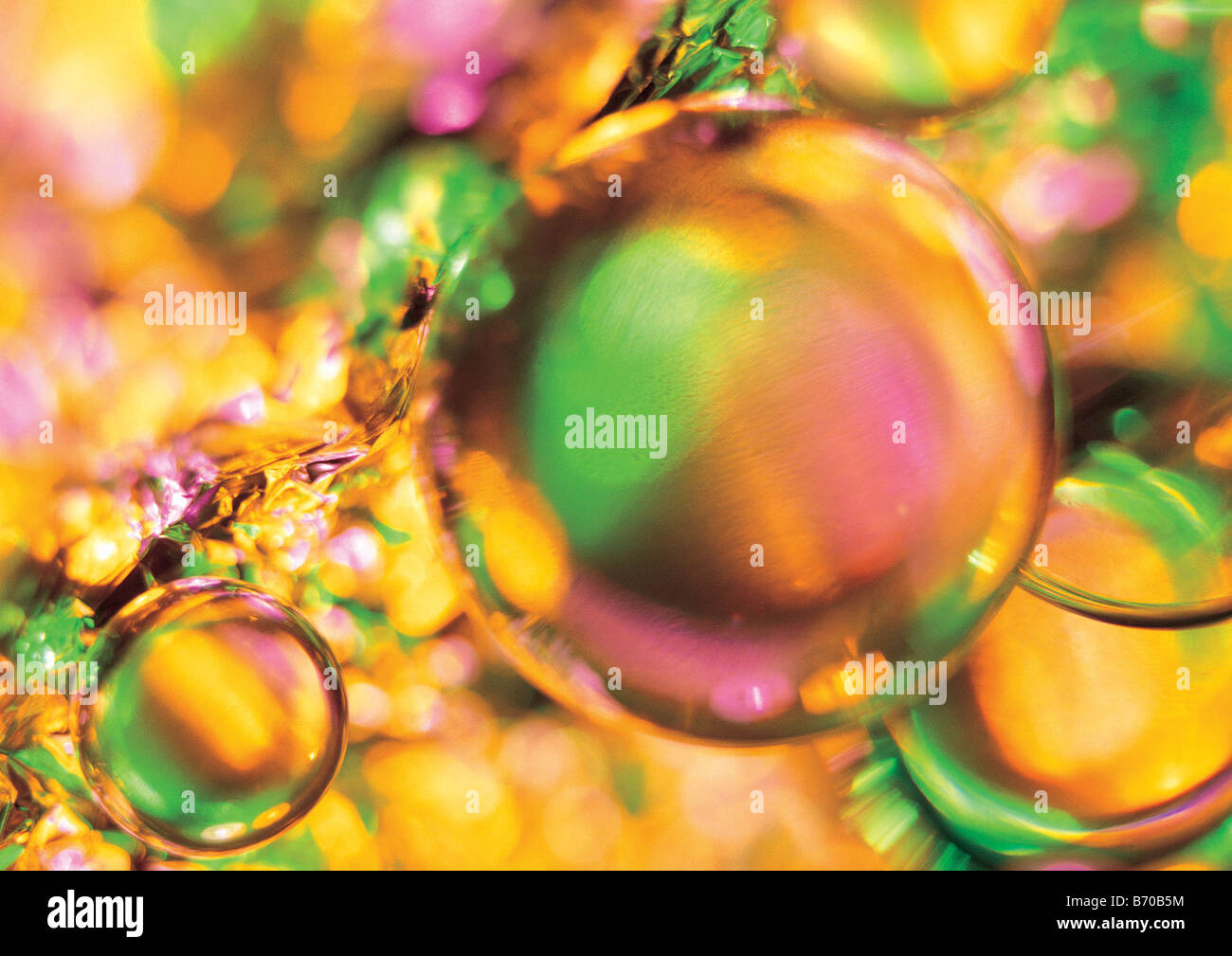 Close-up of bubbles with colorful light Stock Photo - Alamy