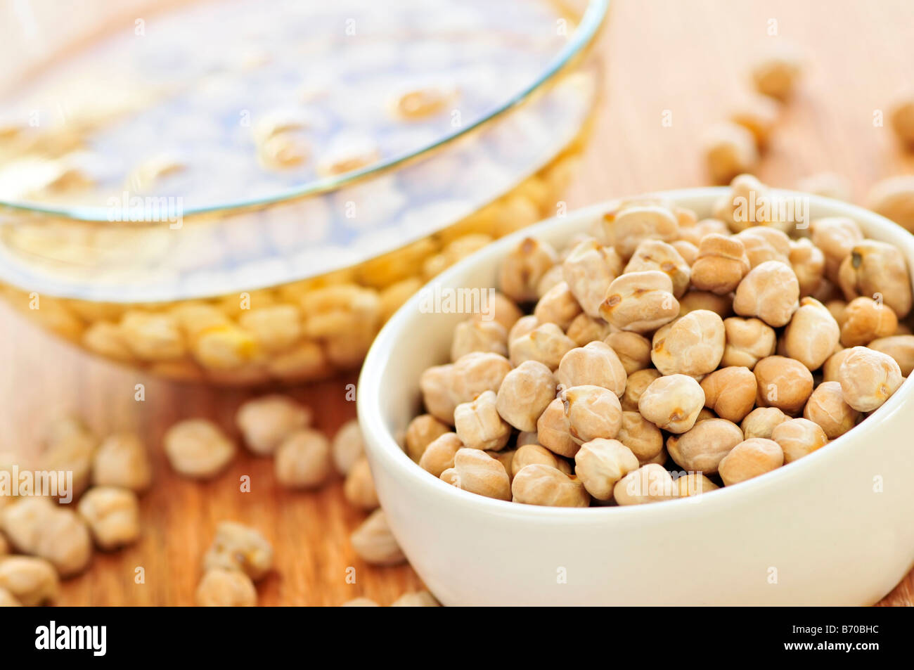 Chickpeas dried in a bowl and soaking in water Stock Photo - Alamy