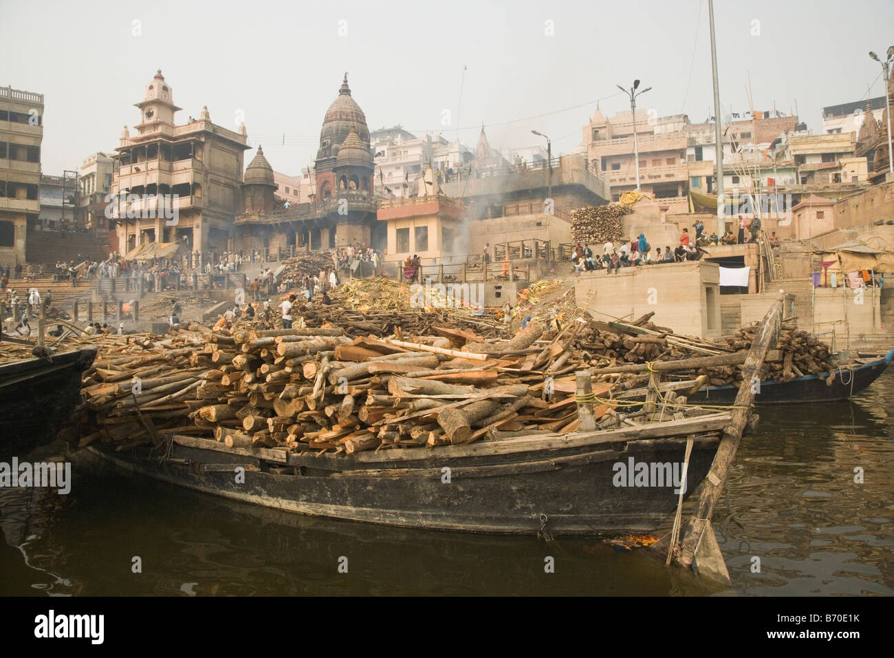 Firewoods on a boat in the river, Ganges River, Manikarnika Ghat ...
