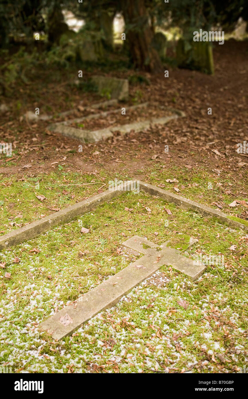 Abandoned graves lying amongst trees Stock Photo - Alamy