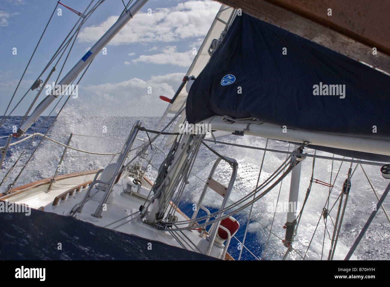 The bow crashes into a wave on a Crealock 34 sailboat making a December ...