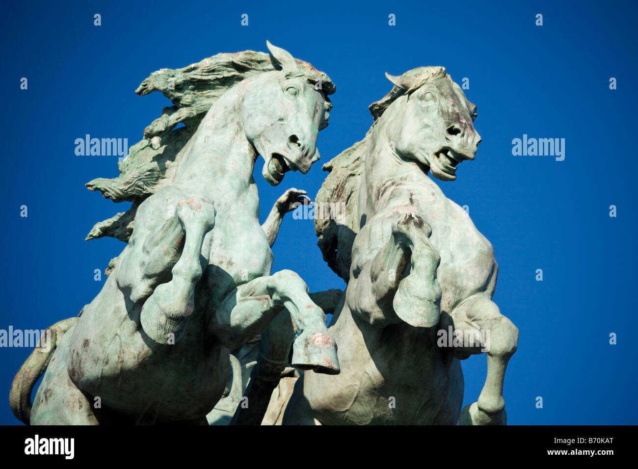 A statue of two horses galloping in Budapest's Heroes' Square Stock ...