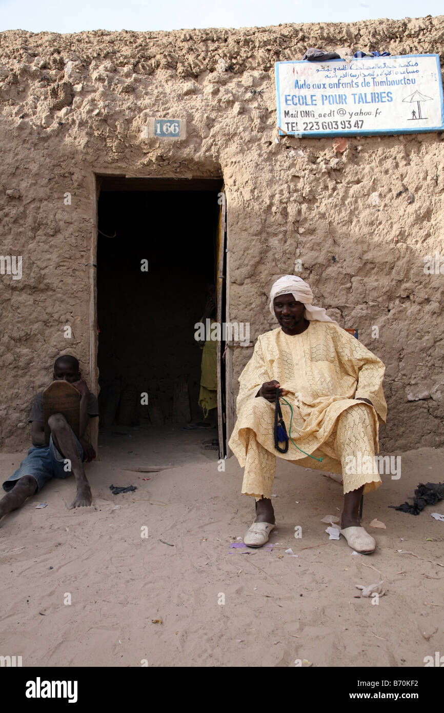 The marabout sitting outside his house in Timbuctu Mali His house is ...