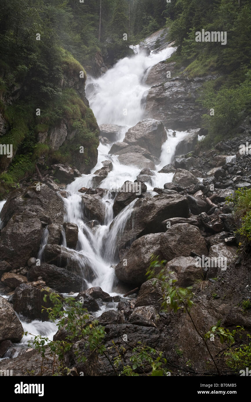 Waterfall in Swiss Alps Stock Photo - Alamy