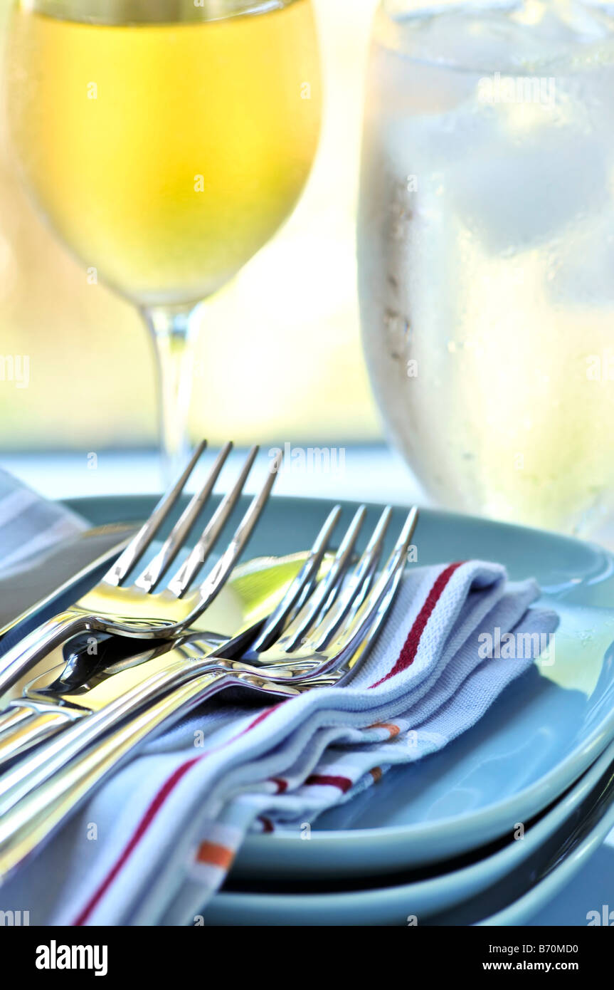 Stacked white plates forks hi-res stock photography and images - Alamy