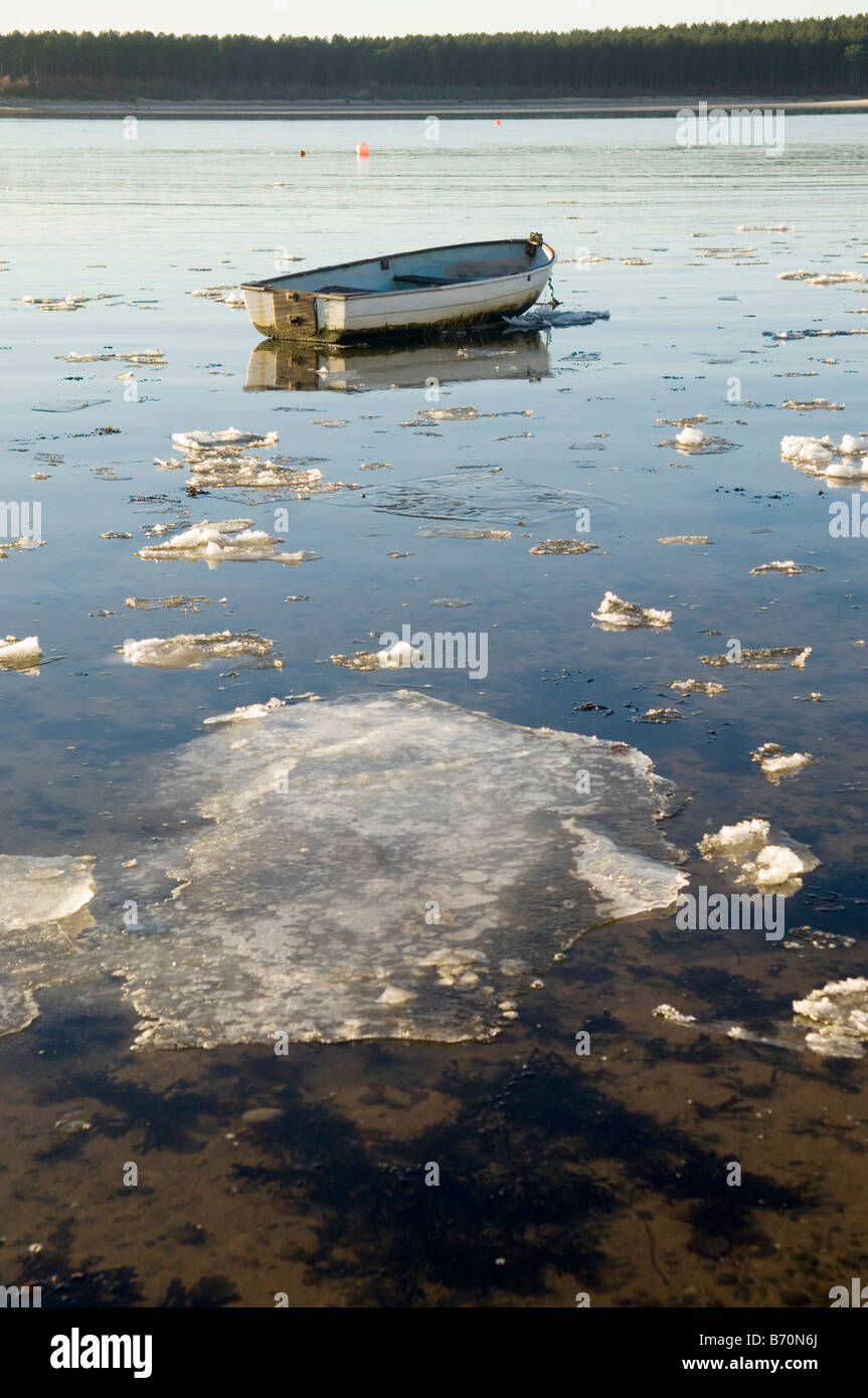 Rowing boat on a ice covered Findhorn bay Stock Photo - Alamy