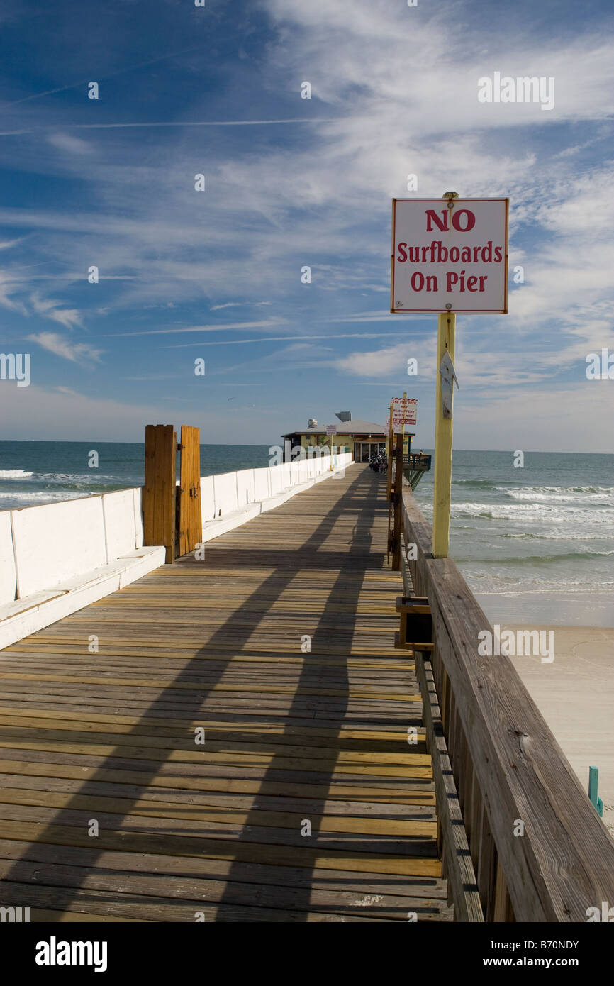The pier in Daytona Beach Florida with a No Surfboards sign Stock Photo ...